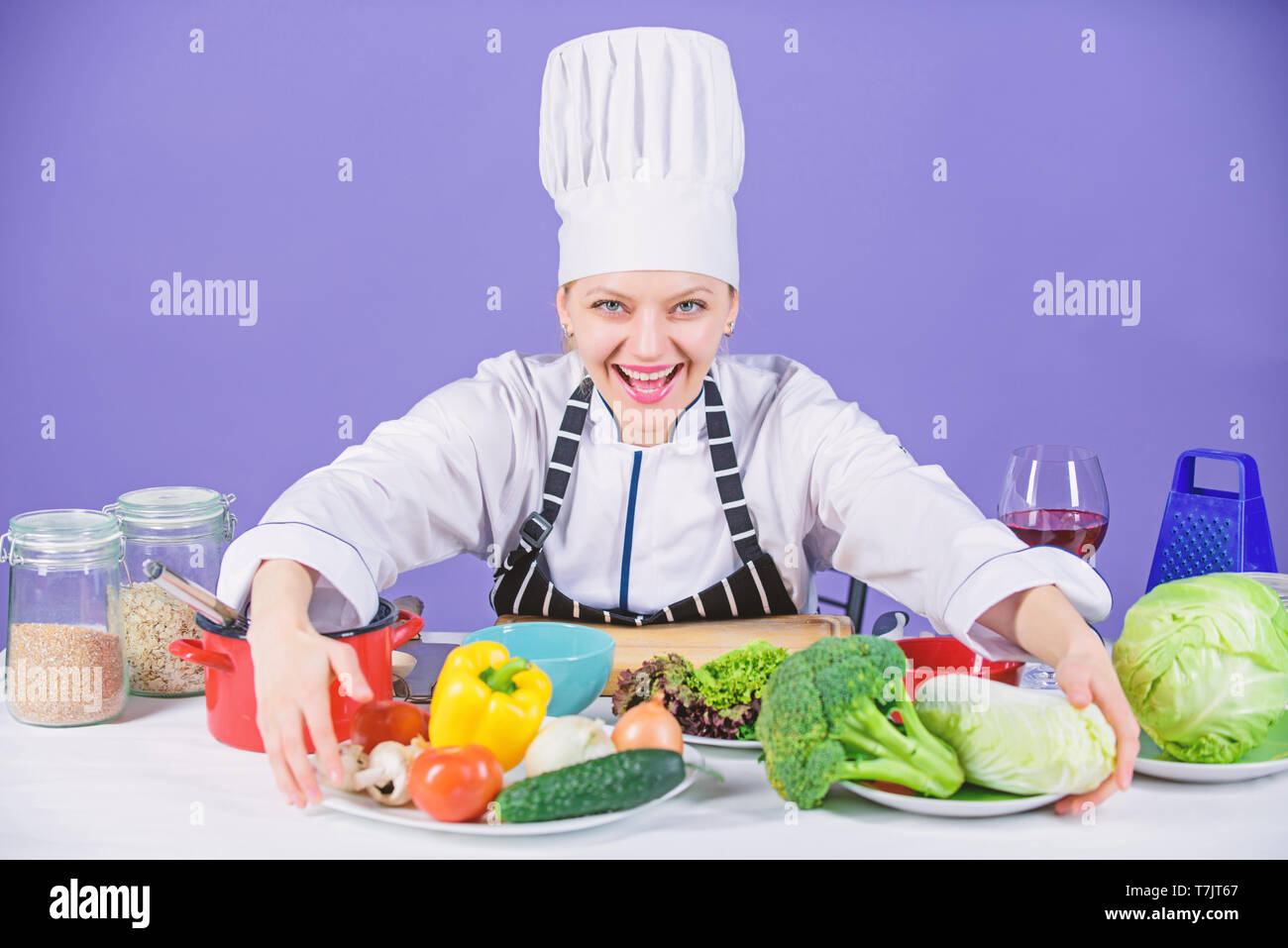 Woman chef cooking healthy food. Gourmet main dish recipes. Delicious ...