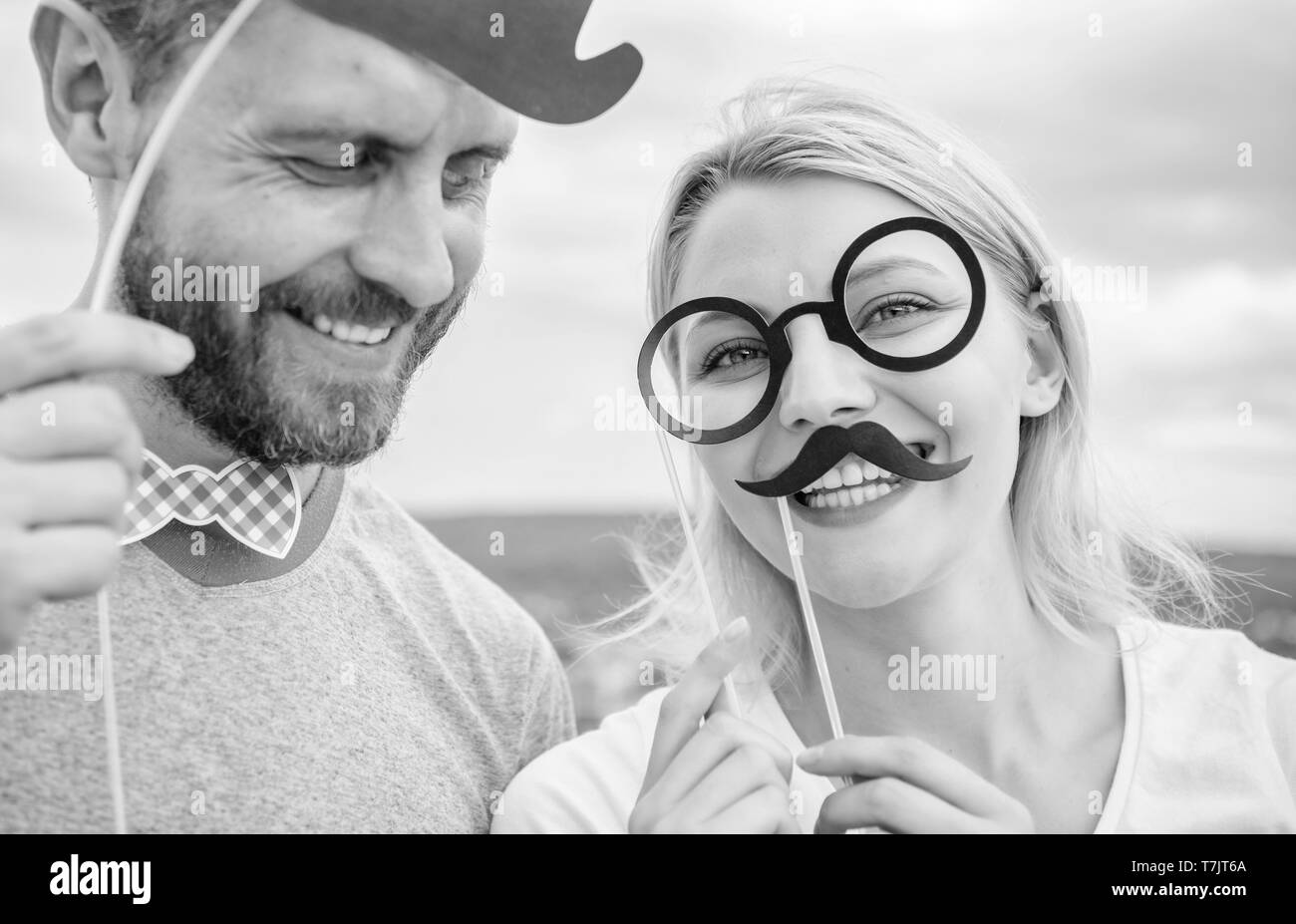 Just for fun. Humor and laugh concept. Couple posing with party props ...