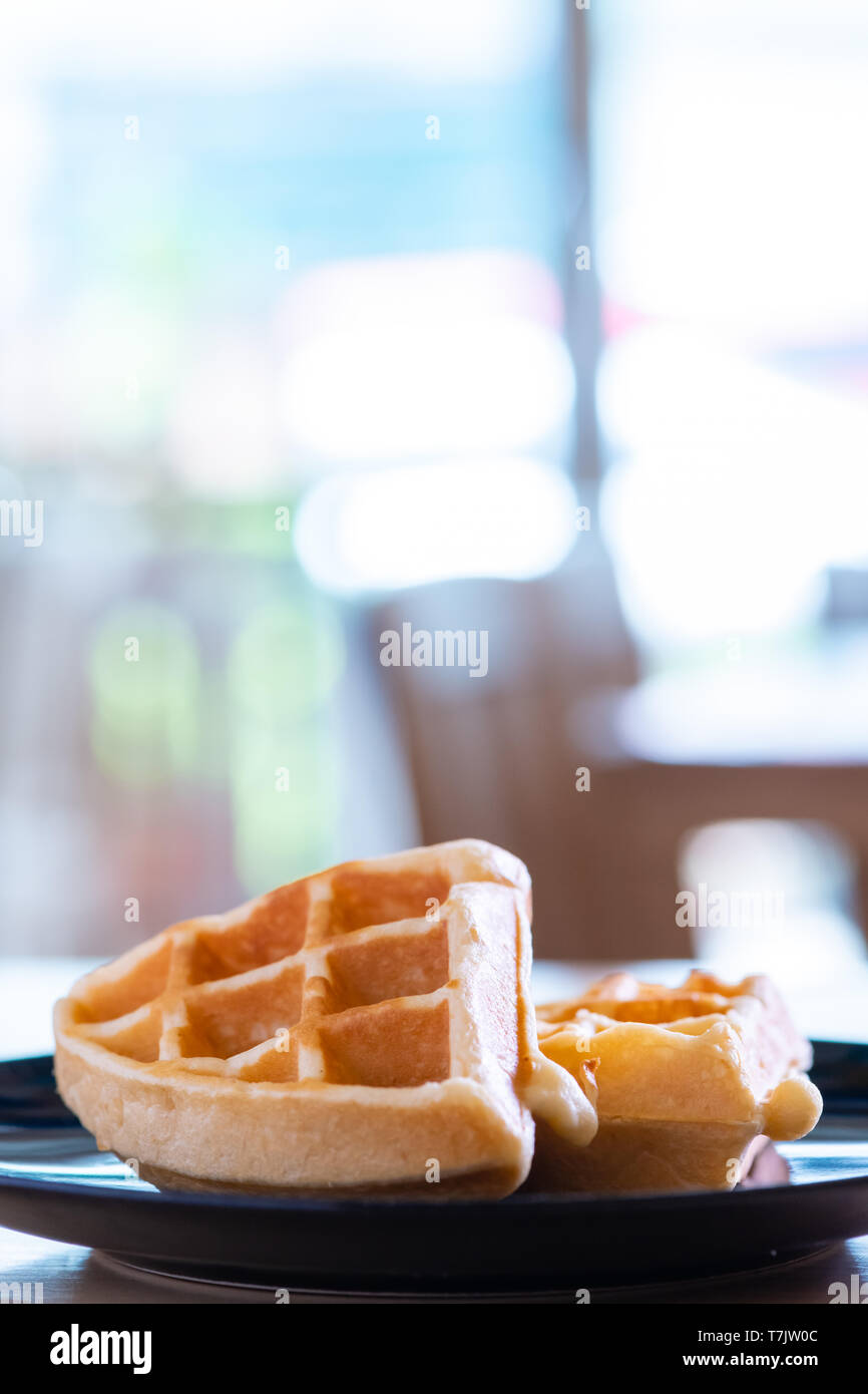 woman hands prepare waffle for serving process.waffle made from dough ...