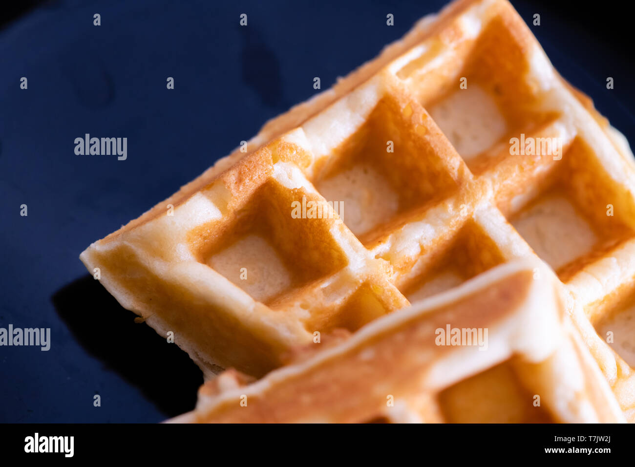 woman hands prepare waffle for serving process.waffle made from dough ...