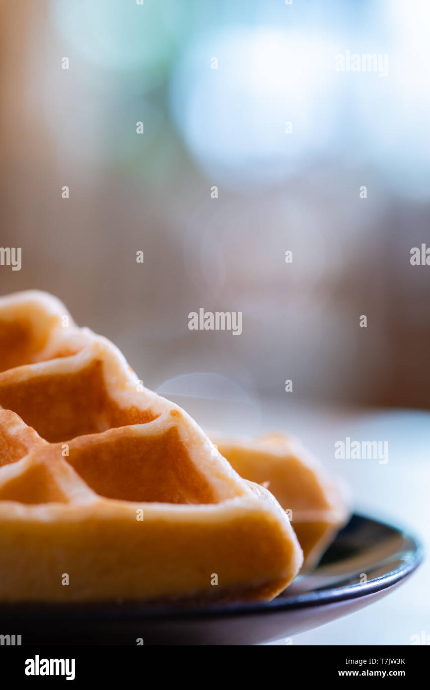 woman hands prepare waffle for serving process.waffle made from dough ...