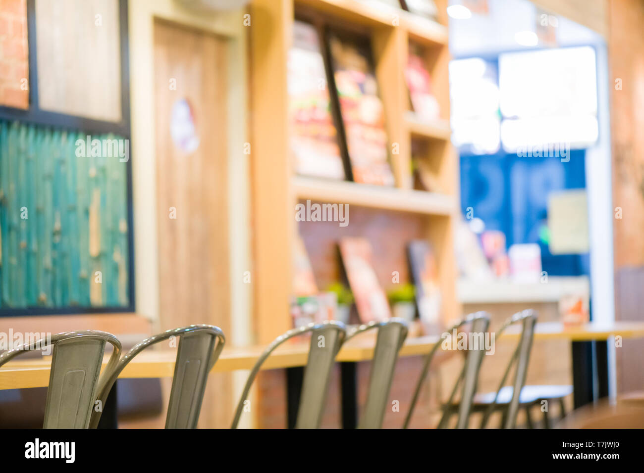 many seat steel chair and wooden table in fast food.beautiful interior ...