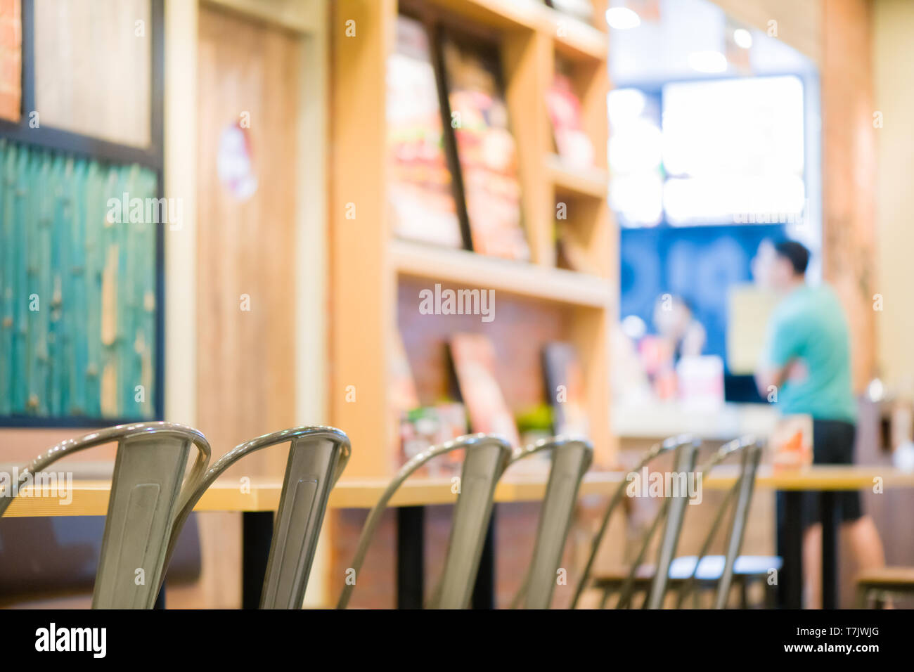 many seat steel chair and wooden table in fast food.beautiful interior ...