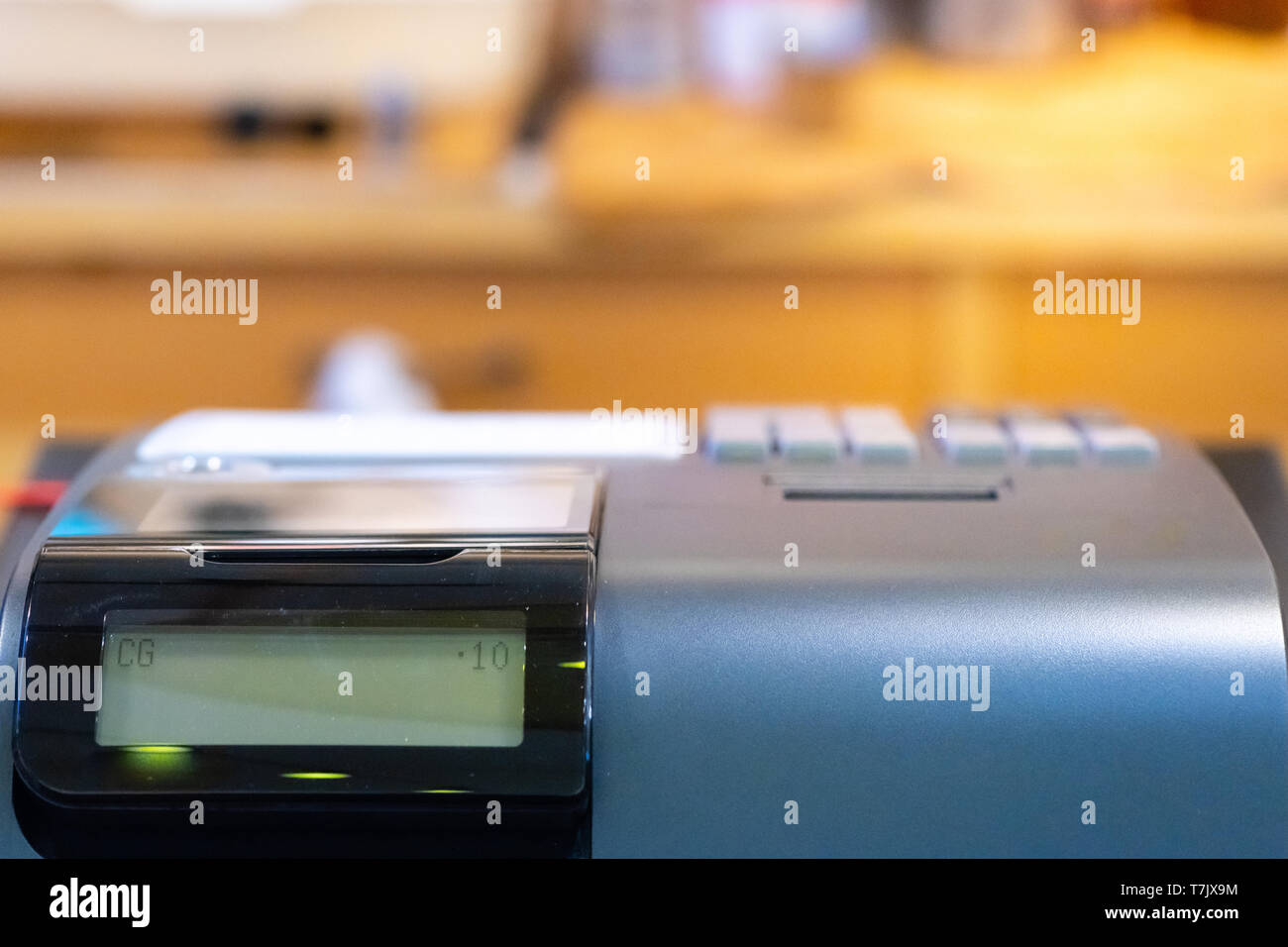 cash register installed on counter for accepting order from customer ...