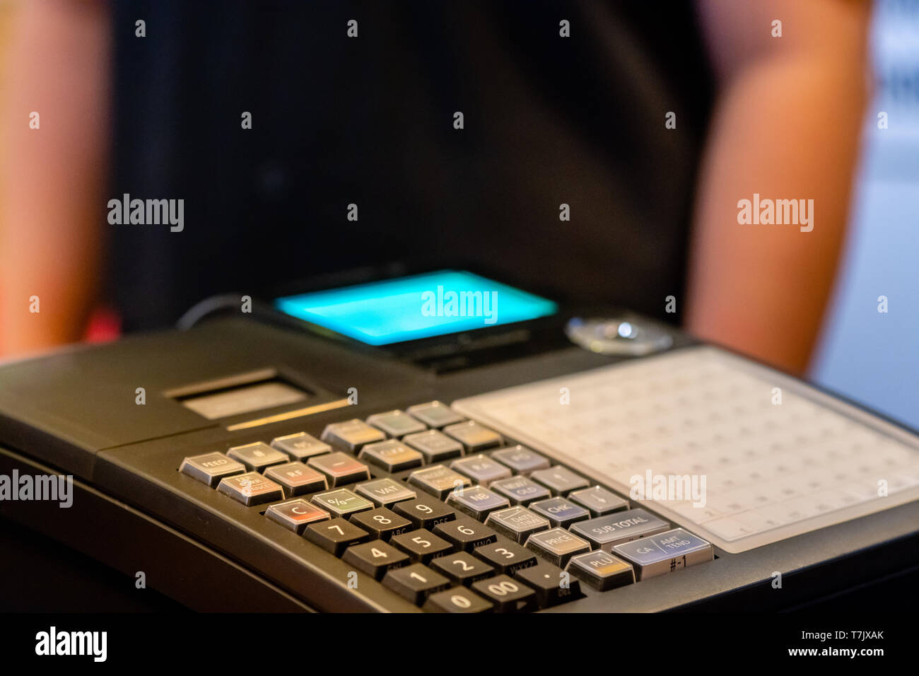 cash register installed on counter for accepting order from customer ...