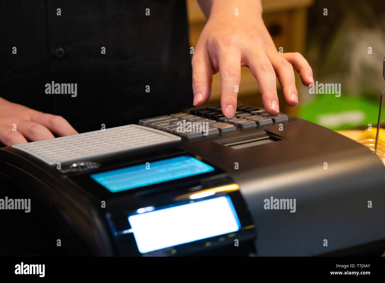 cash register installed on counter for accepting order from customer ...
