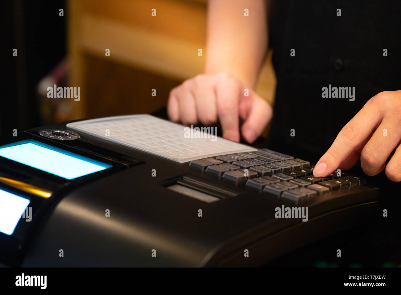 cash register installed on counter for accepting order from customer ...