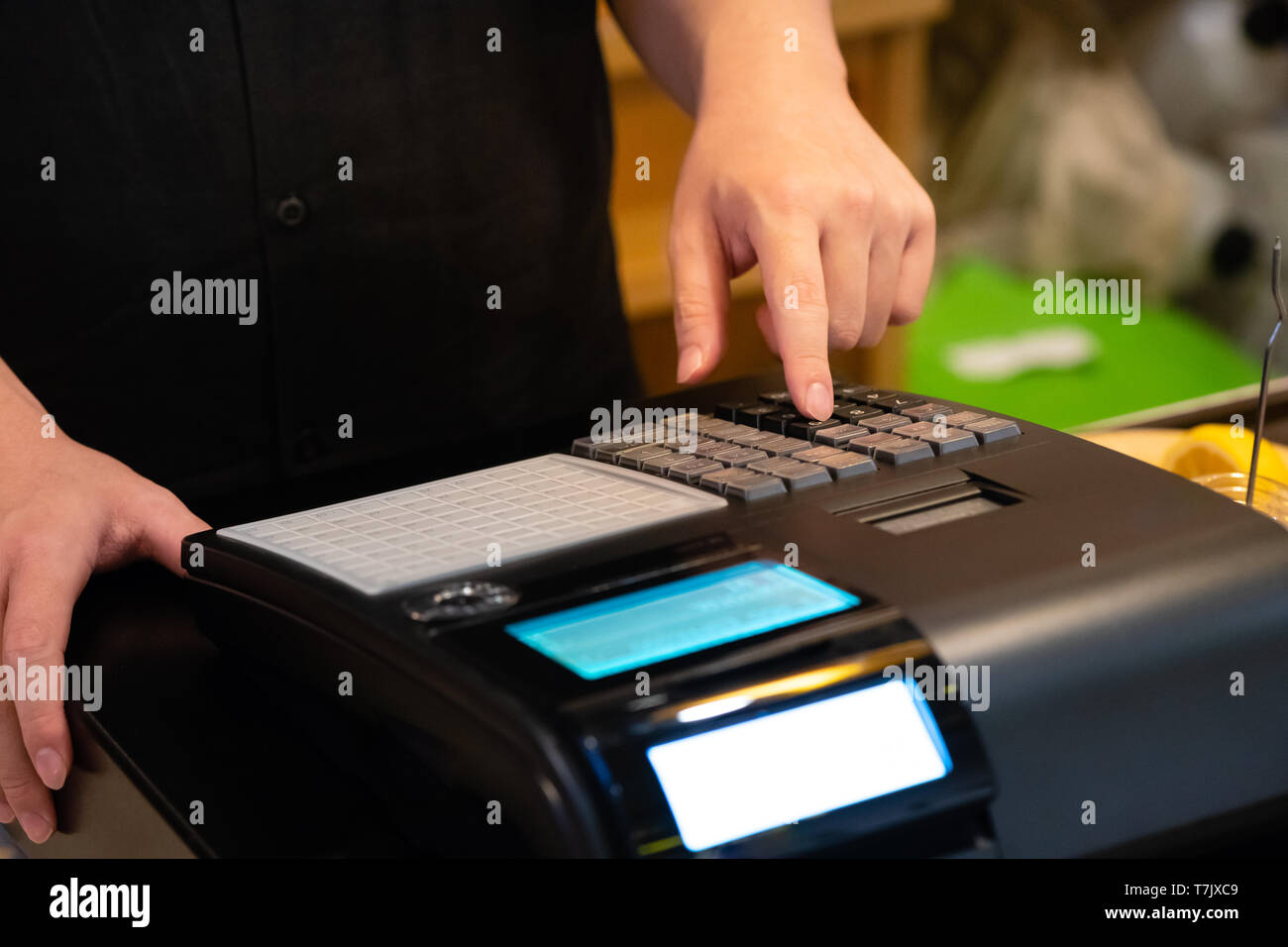 cash register installed on counter for accepting order from customer ...