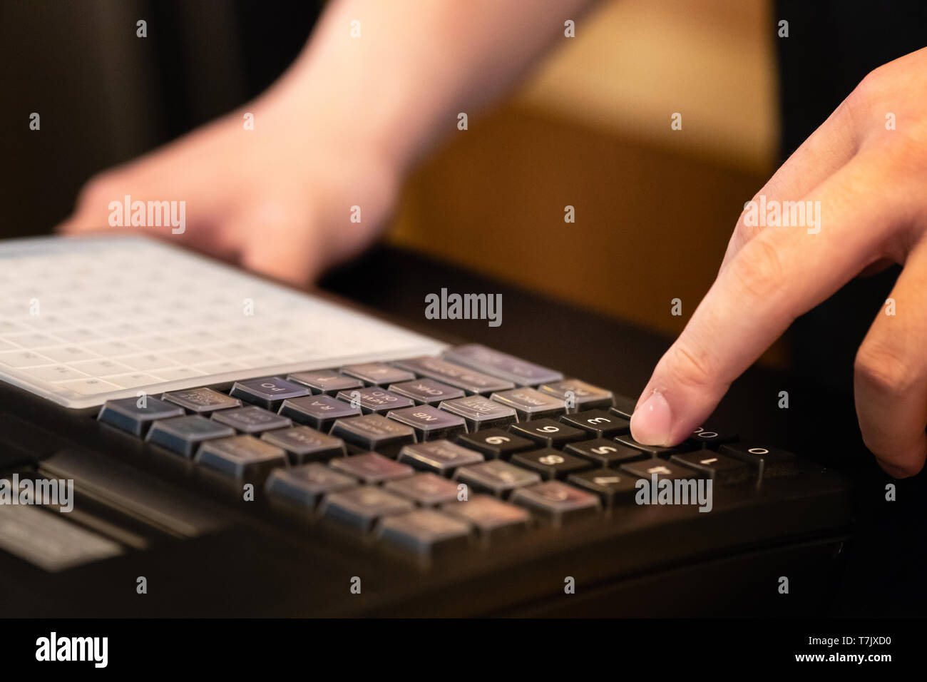 cash register installed on counter for accepting order from customer ...