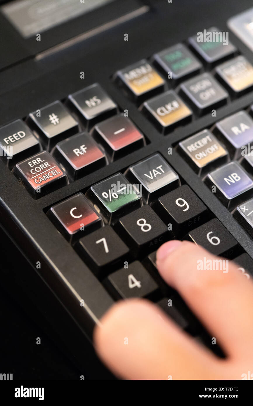 cash register installed on counter for accepting order from customer ...