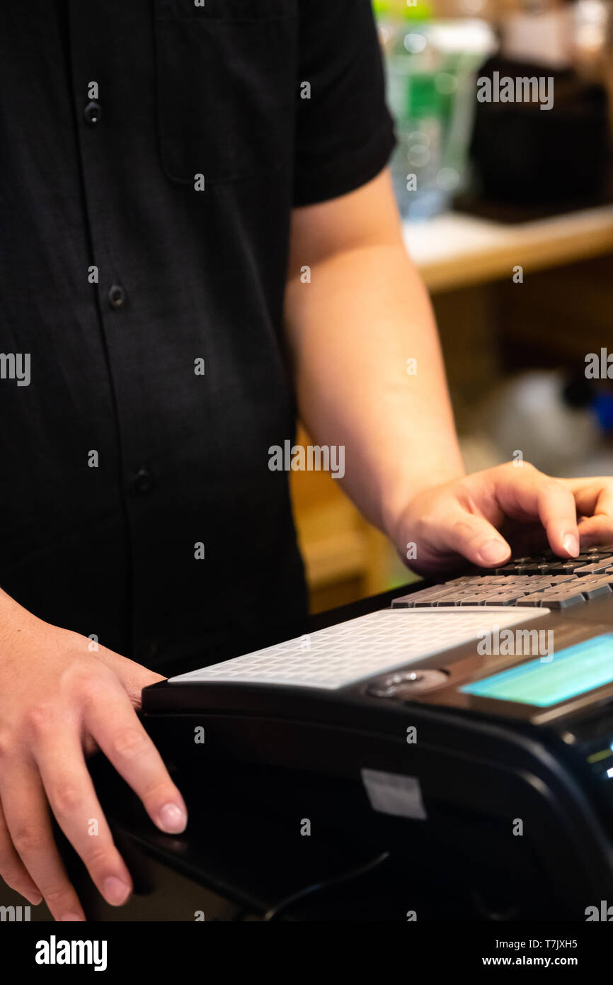 cash register installed on counter for accepting order from customer ...