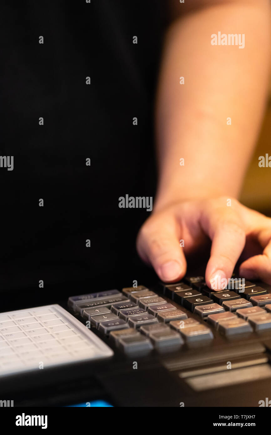 cash register installed on counter for accepting order from customer ...
