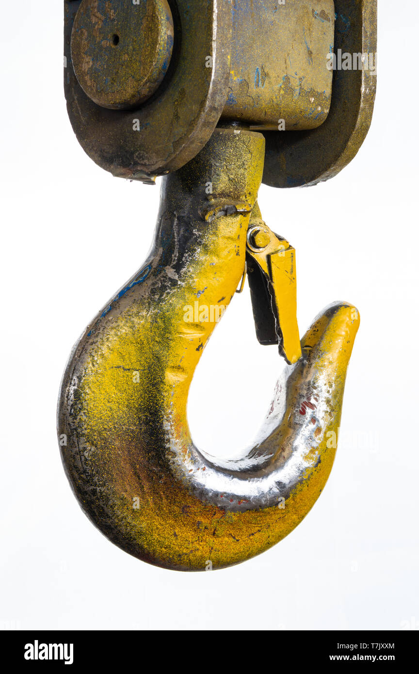 Closeup of a industrial yellow lifting crane hook on a white background ...