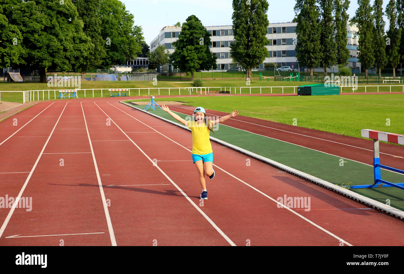 Little girl have fun on the stadium Stock Photo - Alamy