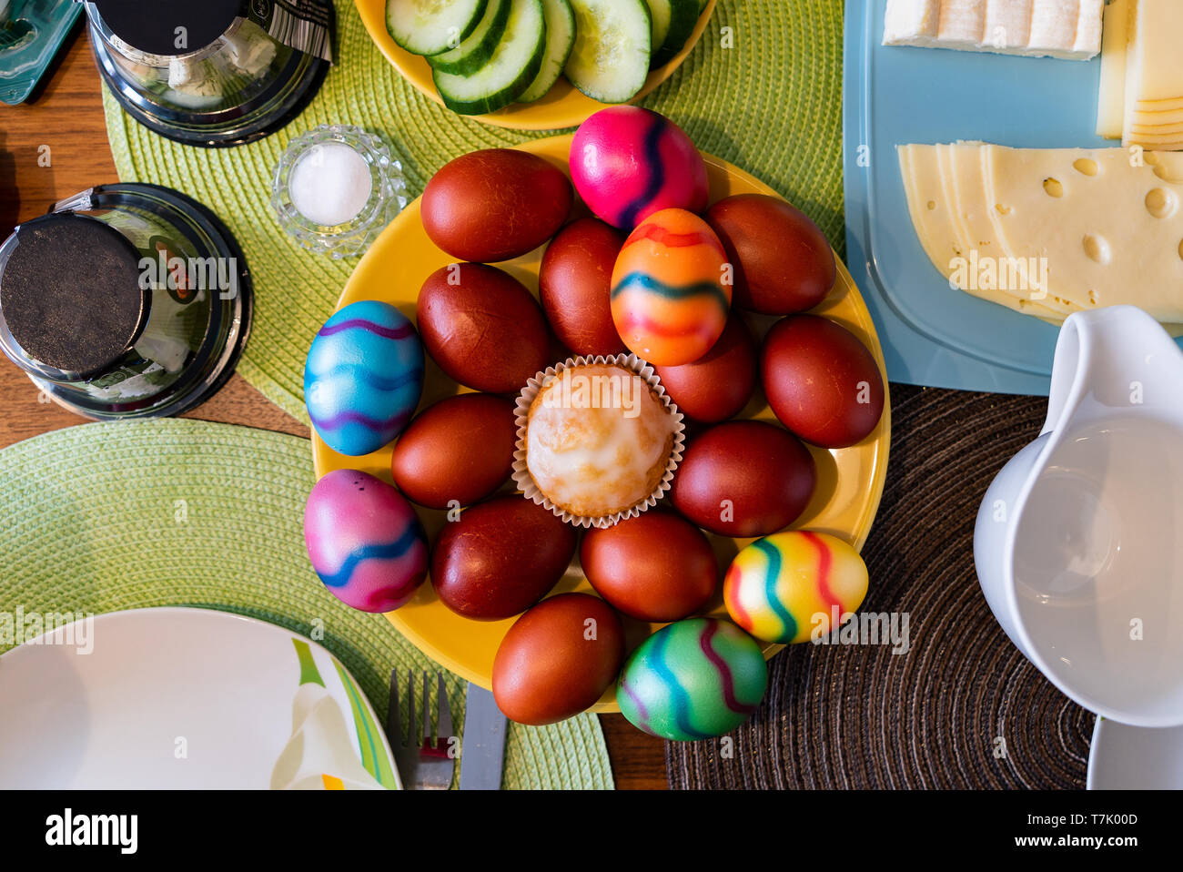 A top view on colored eggs arranged on a plate as a traditional symbol ...