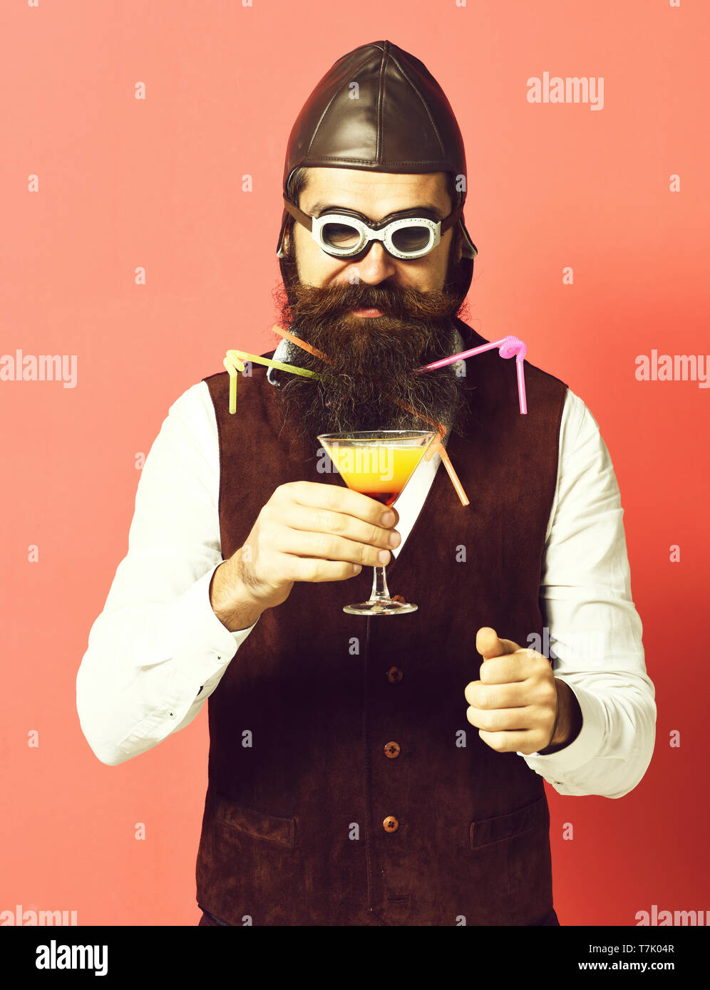 handsome bearded pilot or aviator man with long beard and mustache on ...