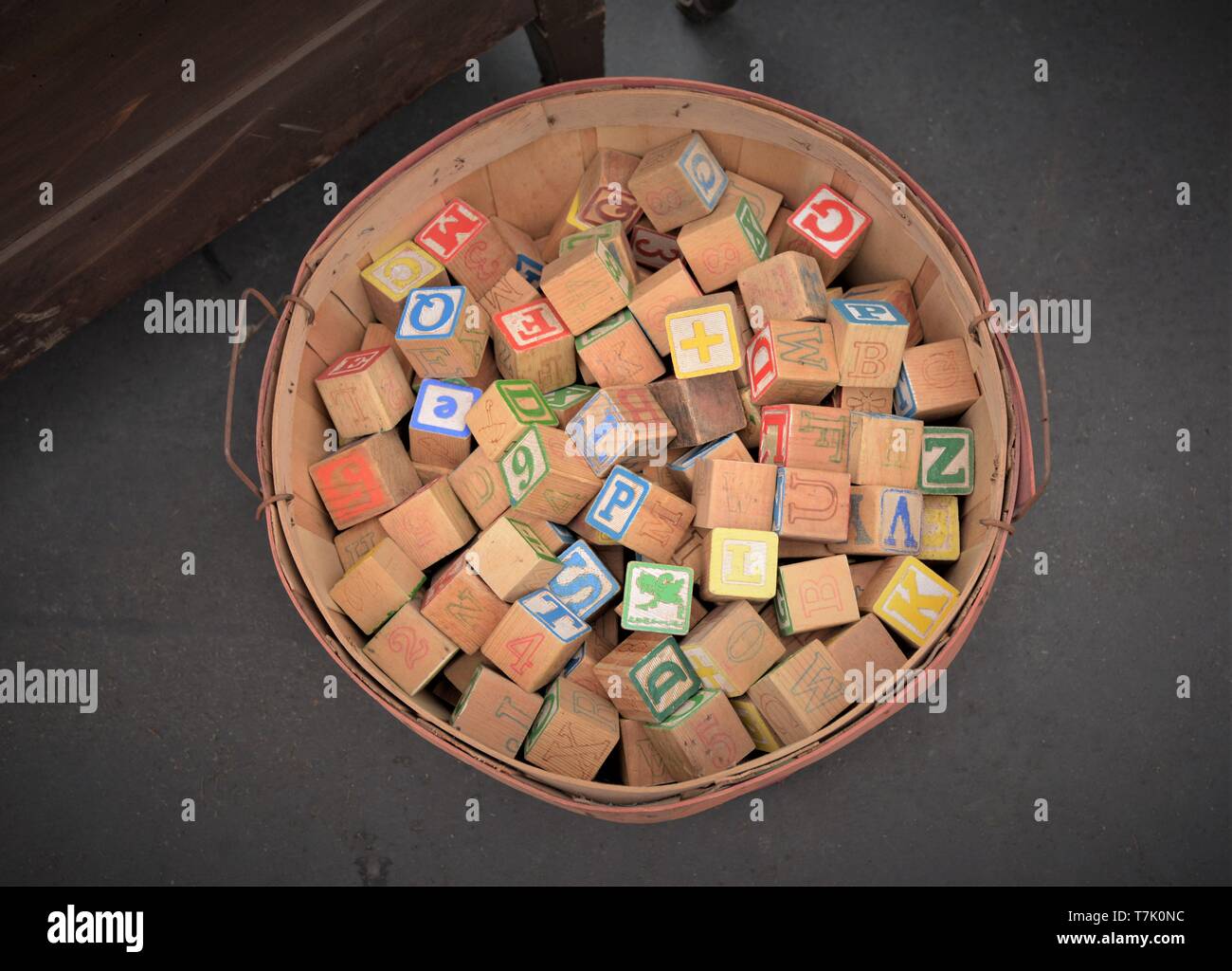 Kids play blocks with letters in bucket Stock Photo - Alamy
