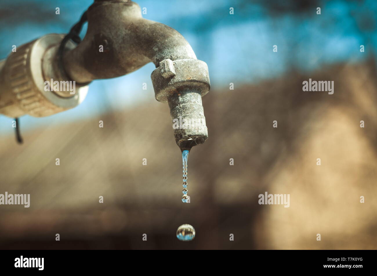 Old tap outdoors with the water drops Stock Photo - Alamy