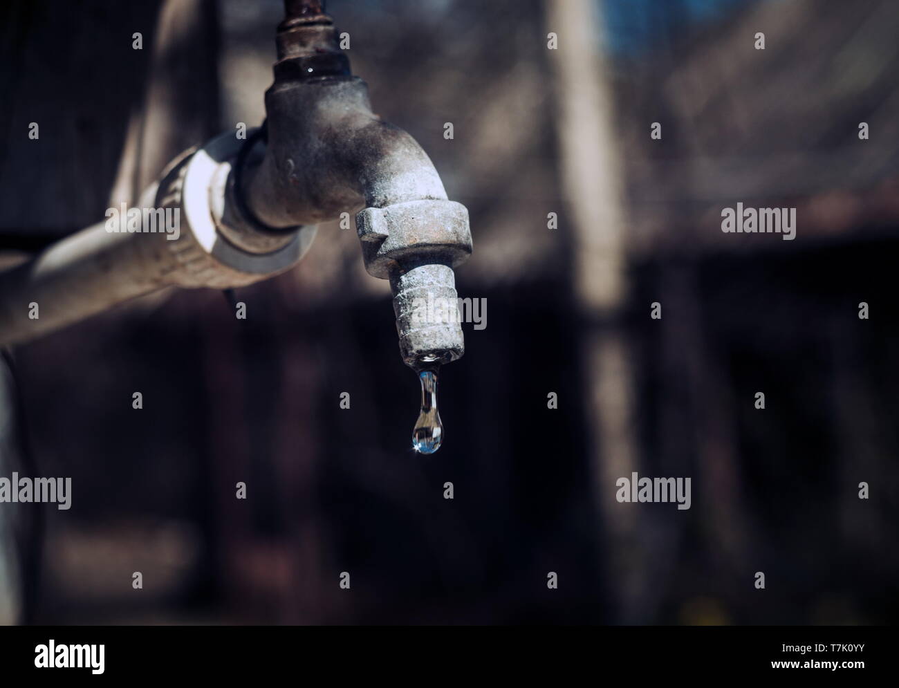 Old tap outdoors with the water drops Stock Photo - Alamy