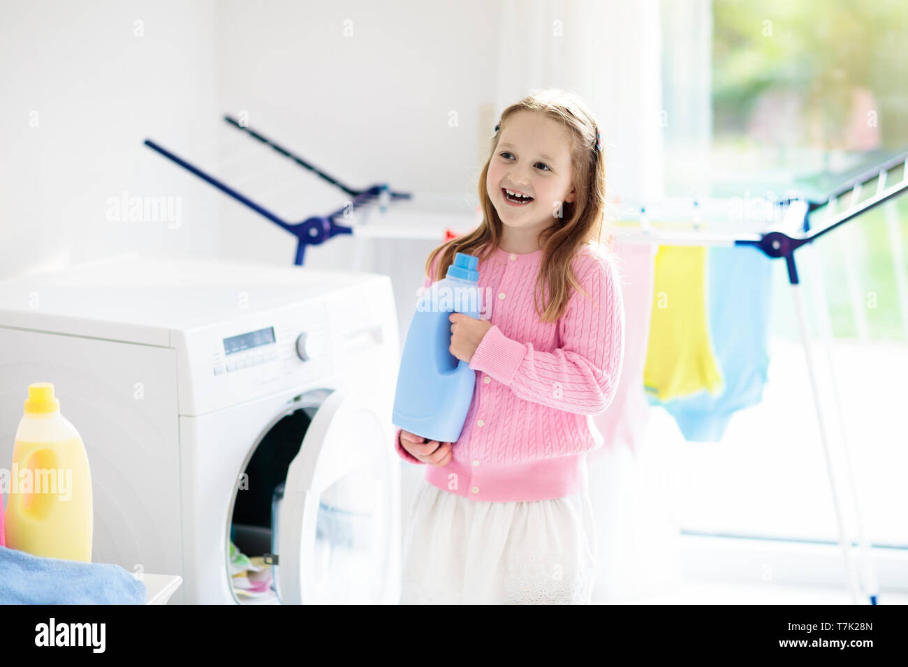 Child girl washing machine hi-res stock photography and images - Alamy