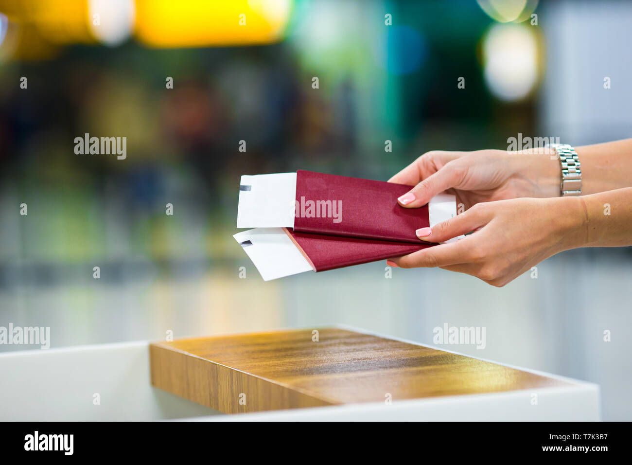 Closeup passports and boarding pass at the reception area in airport ...