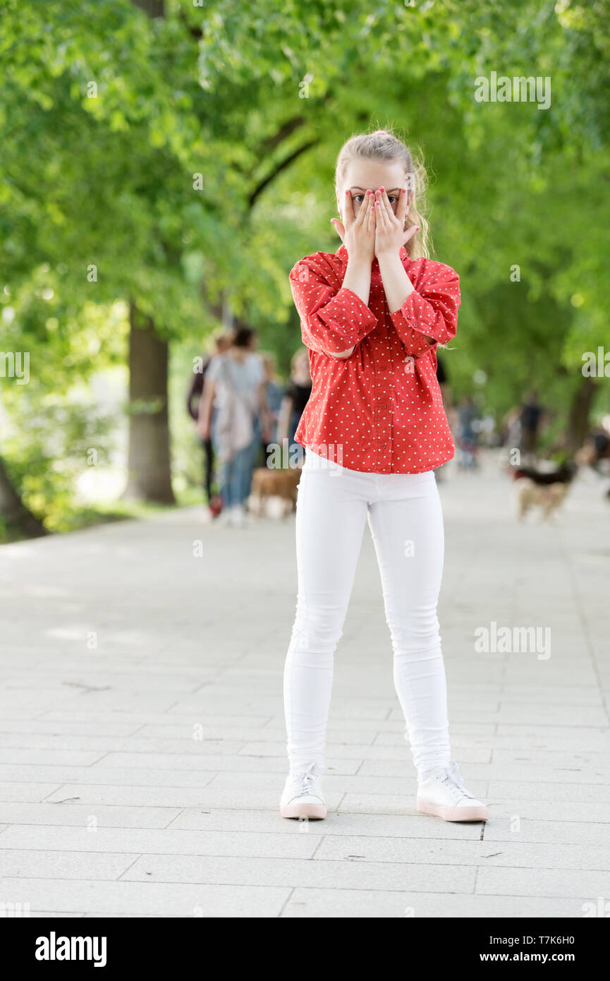 Happy hiding game outdoors. Hide and seek urban background. Happy ...