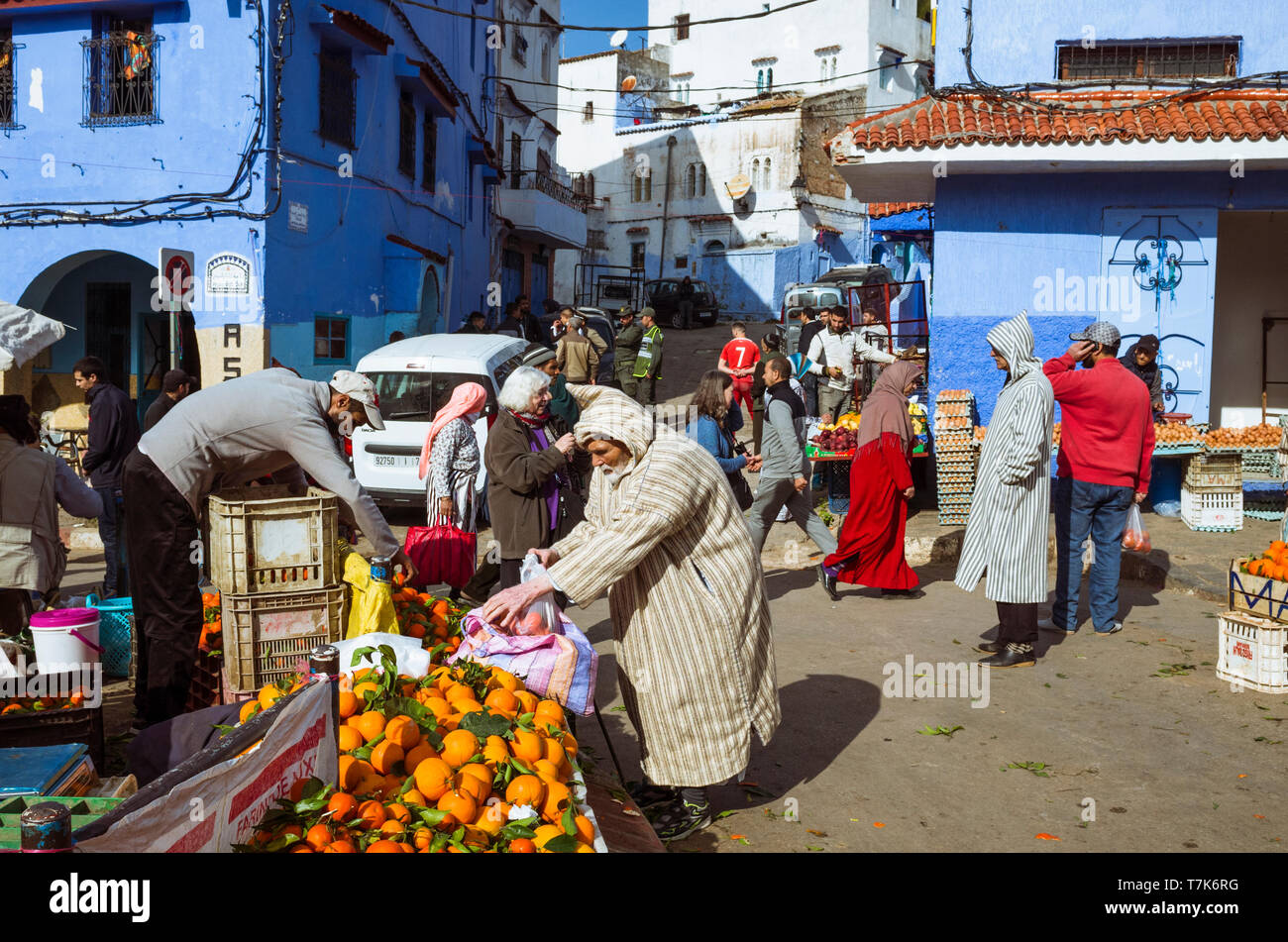 Chefchaouen, Morocco : A senior Moroccan man wearing a djellaba shops ...