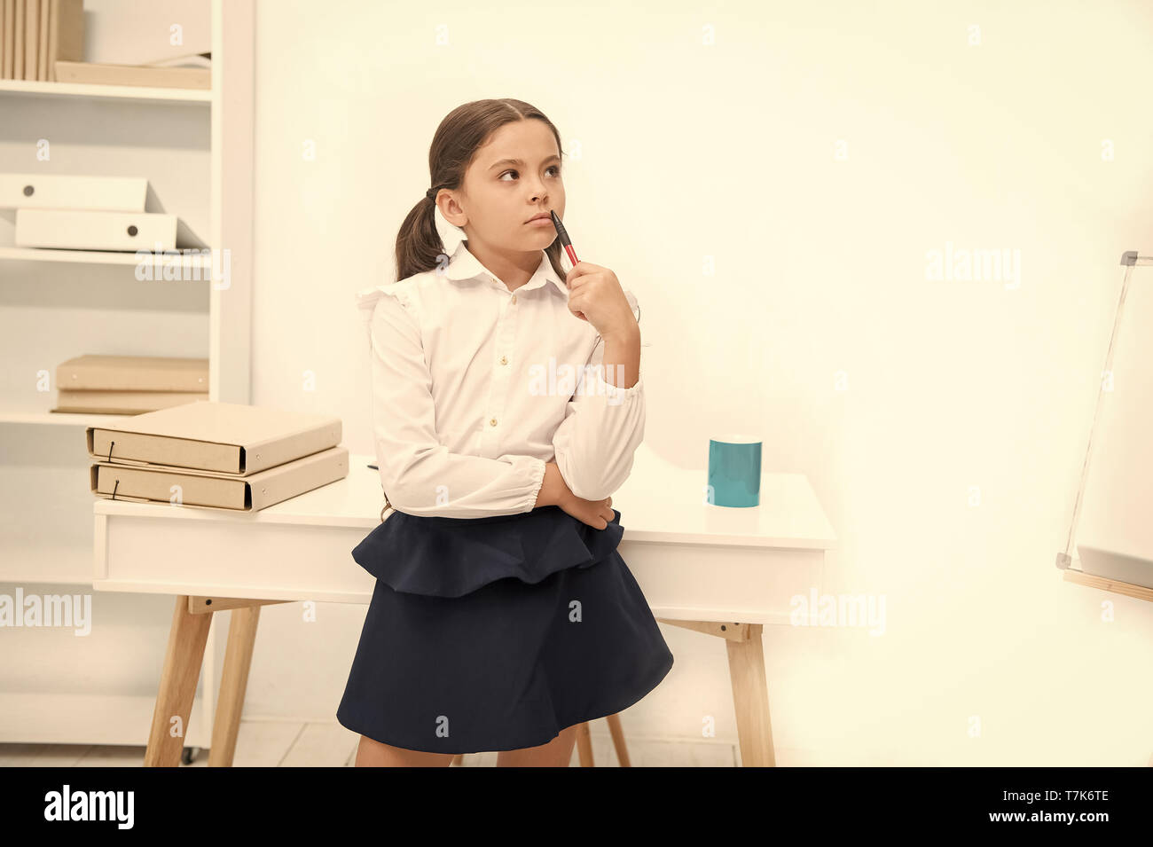 Genius concept. Genius girl lost in thoughts. Genius child solve ...