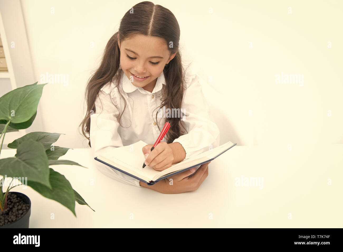 Knowledge concept. School girl write at lesson, knowledge. Knowledge ...