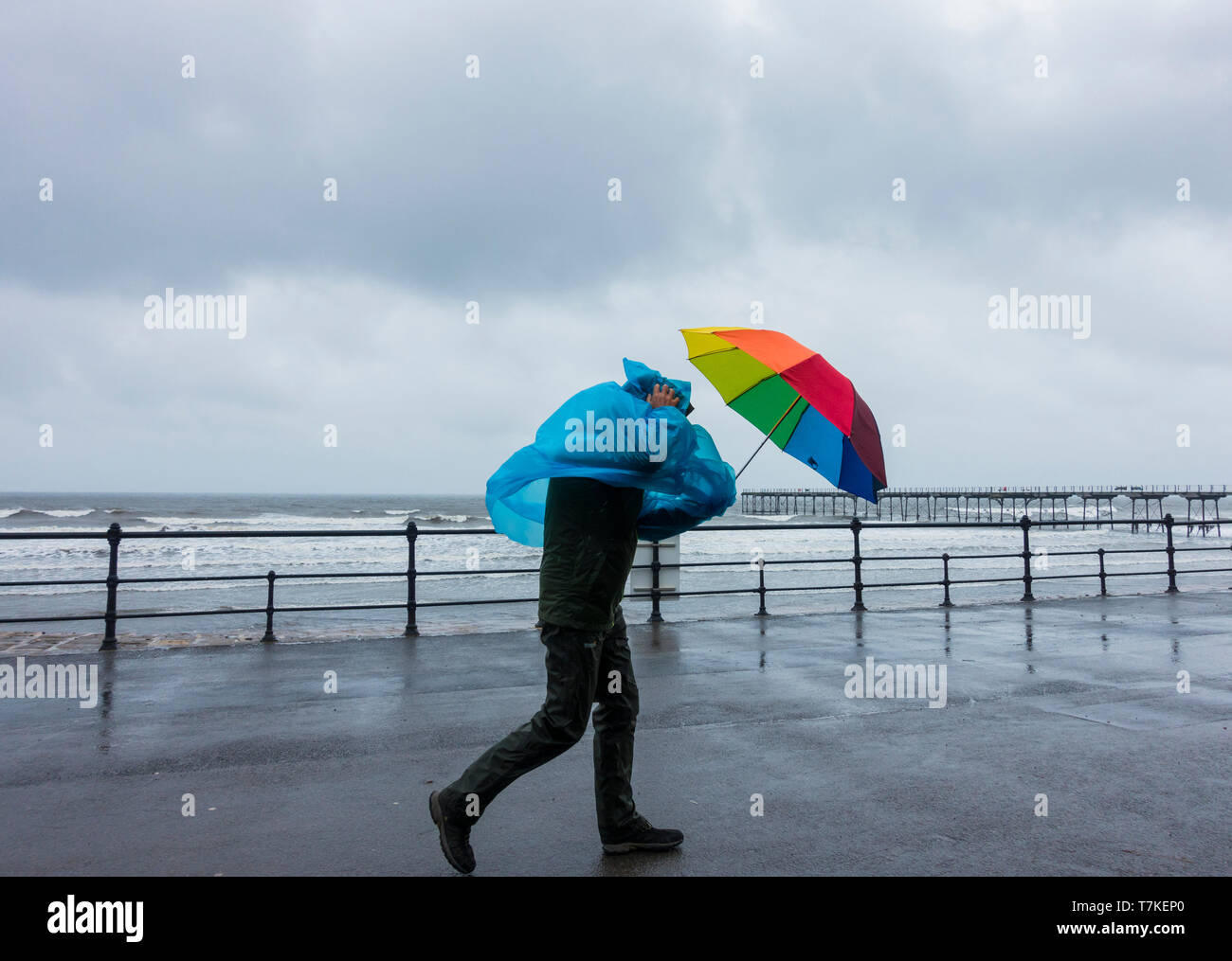 Man on beach and umbrella and windy hi-res stock photography and images ...