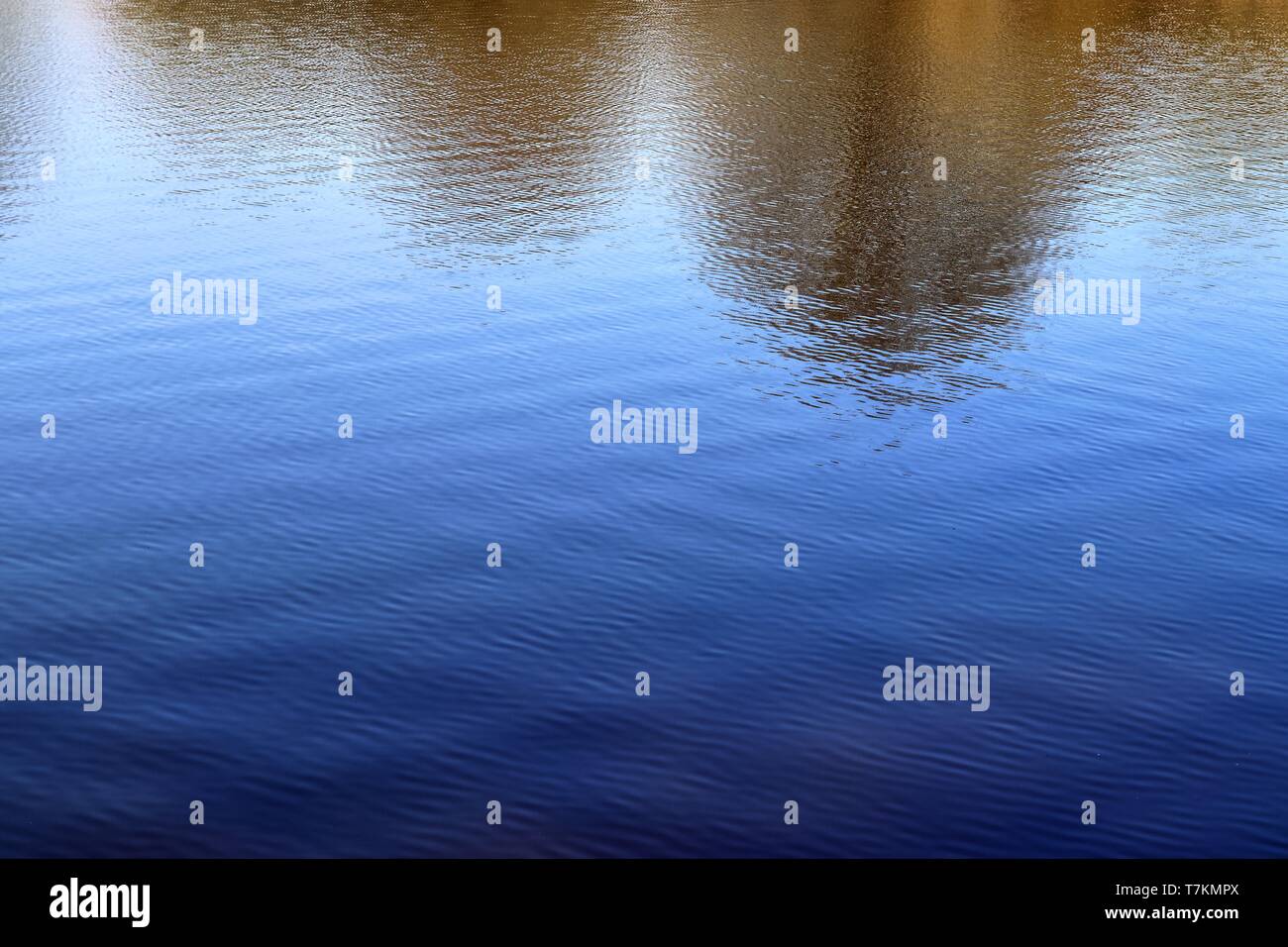 Close up surface of floating water with ripples and waves and some ...