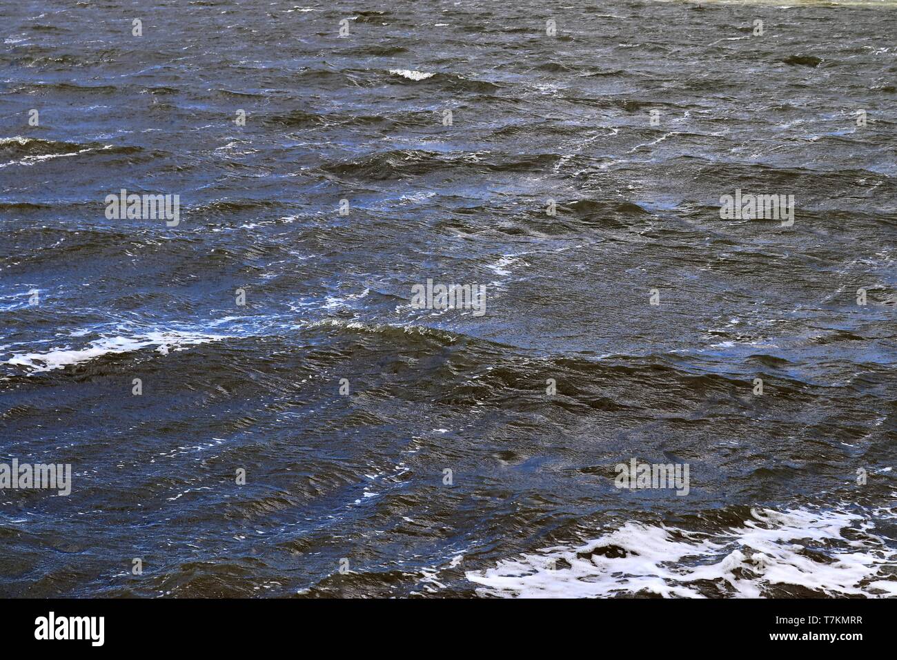 Close up surface of floating water with ripples and waves and some ...