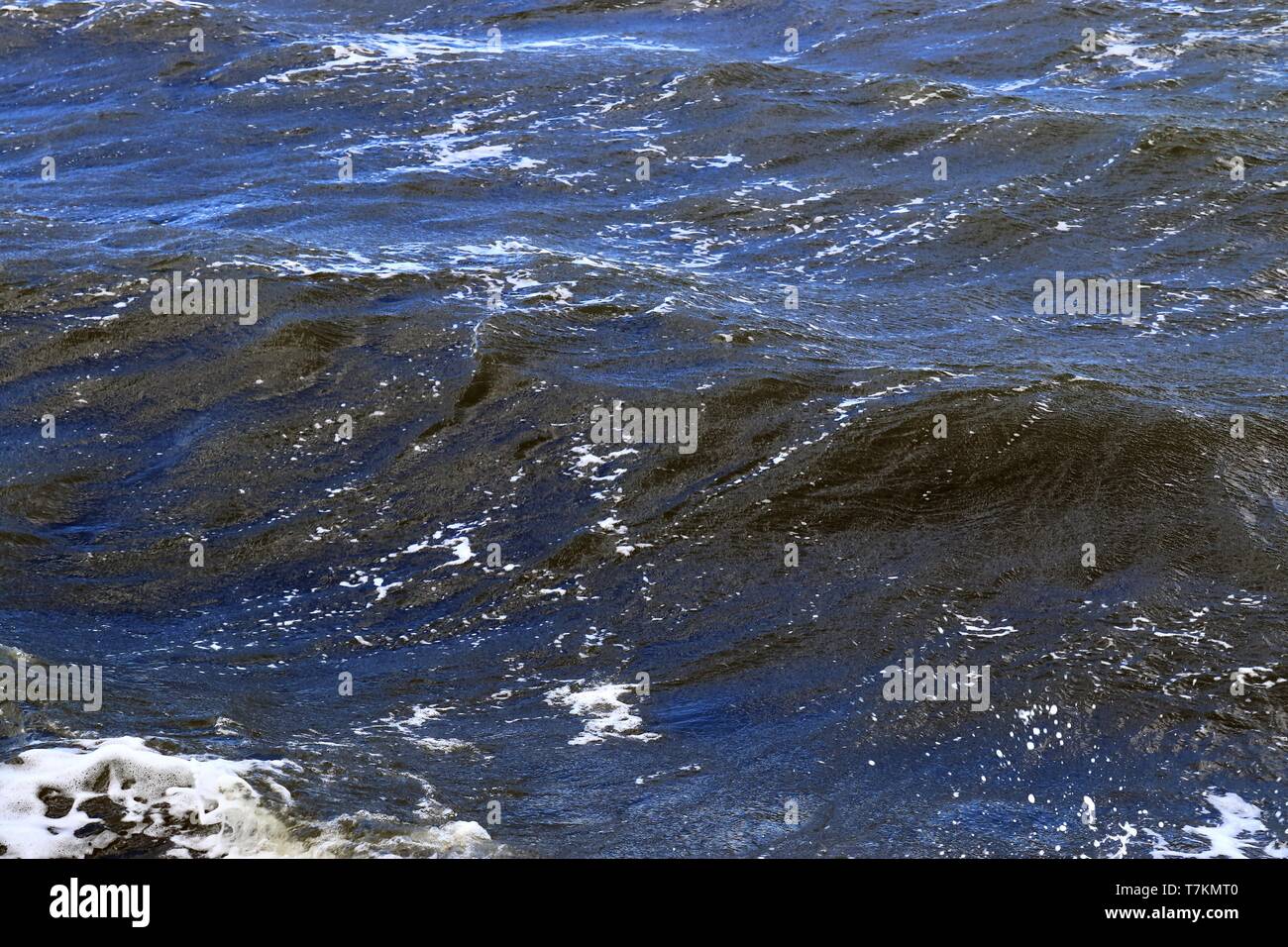 Close up surface of floating water with ripples and waves and some ...