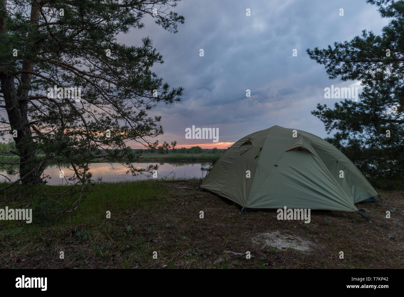 Tourist tent on the background of the sunset sun.Turistic tent at the ...