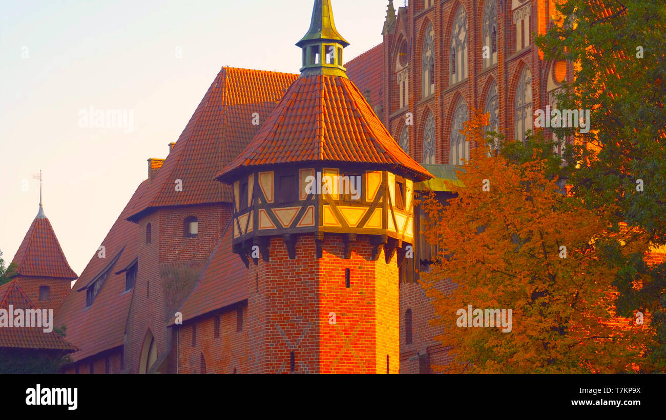 The roof of an old building in Poland. The color of the wall is red in ...