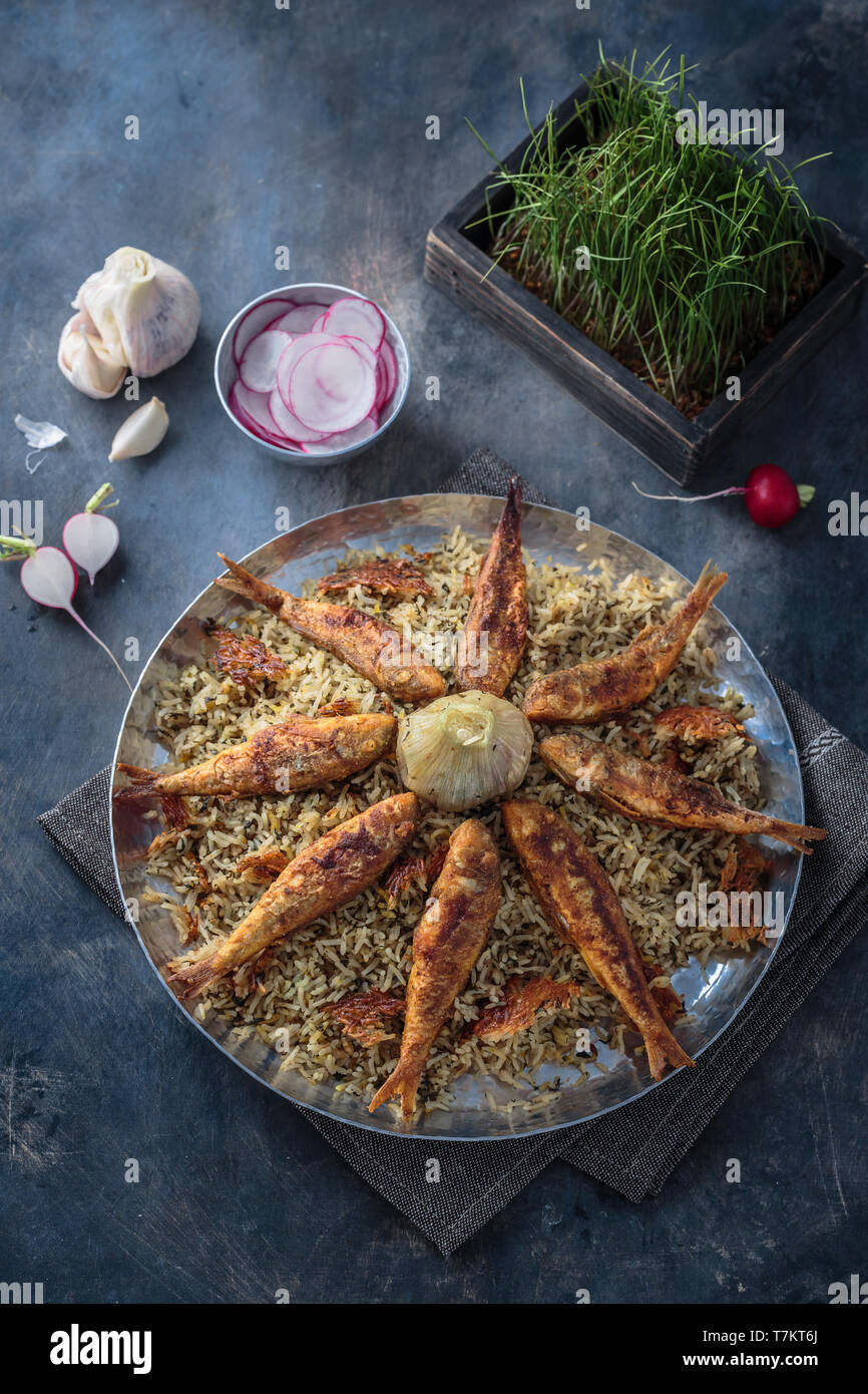 Rice pilaf with different herbs and fish. persian cuisine Stock Photo ...