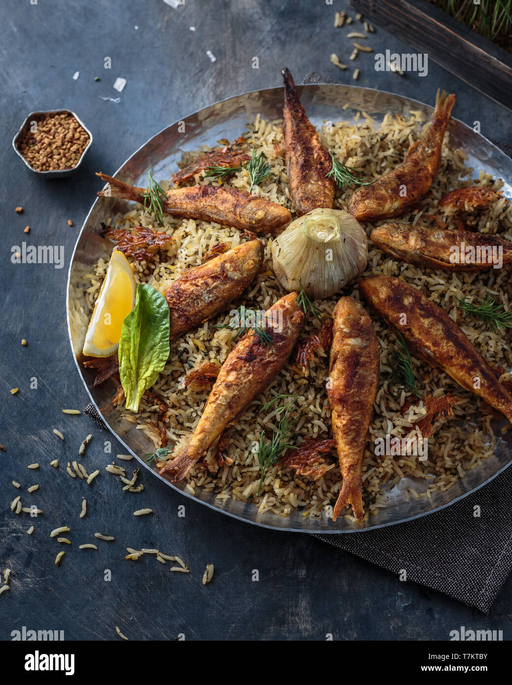 Close view Herbed Persian Rice and Pan-fried Fish Stock Photo - Alamy