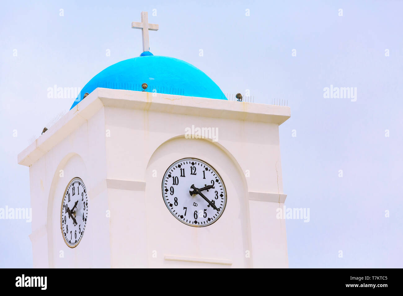 Traditional clock tower of a church in Milos island, Greece Stock Photo ...