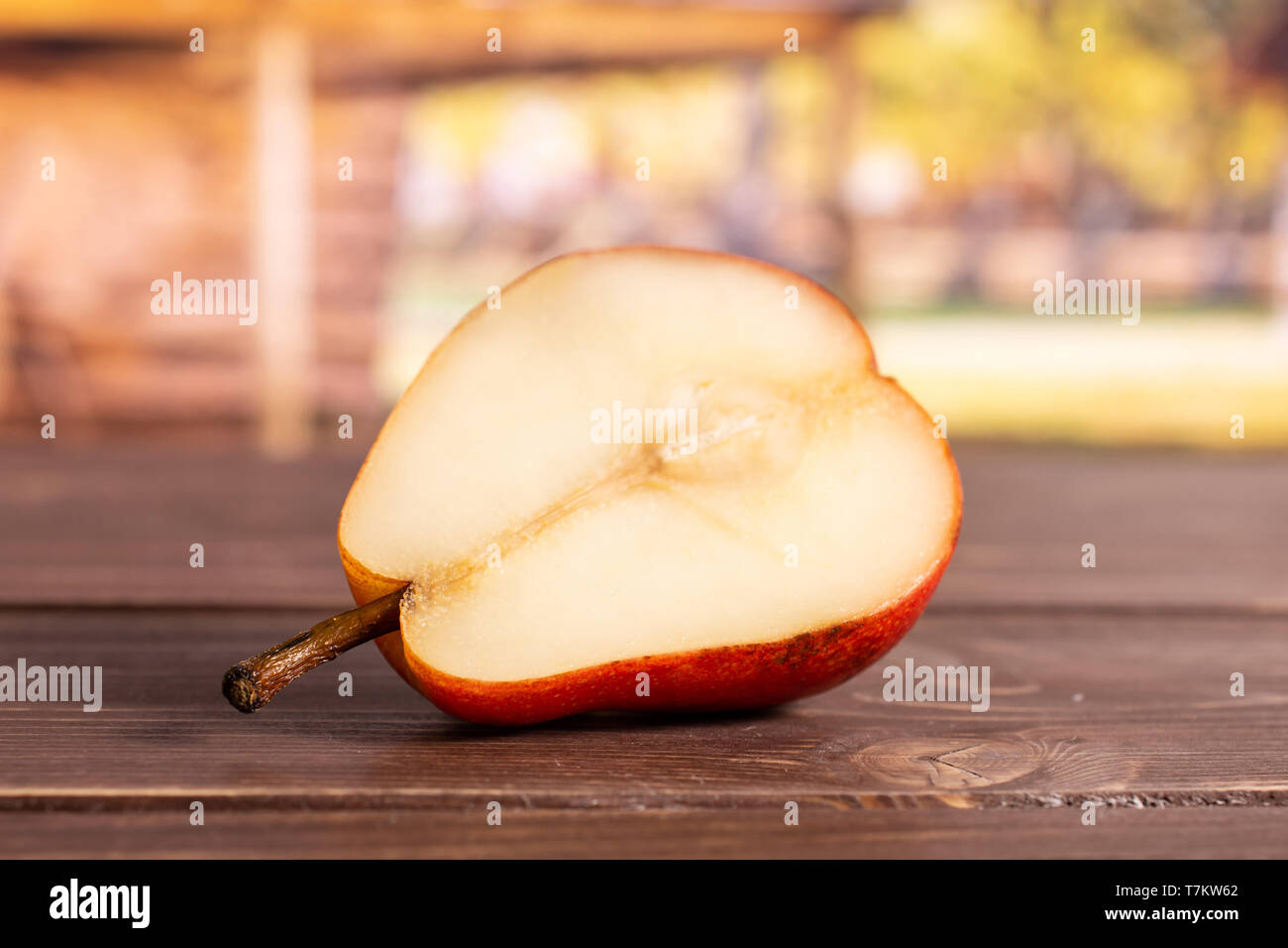 One half of fresh red pear in a yard Stock Photo - Alamy