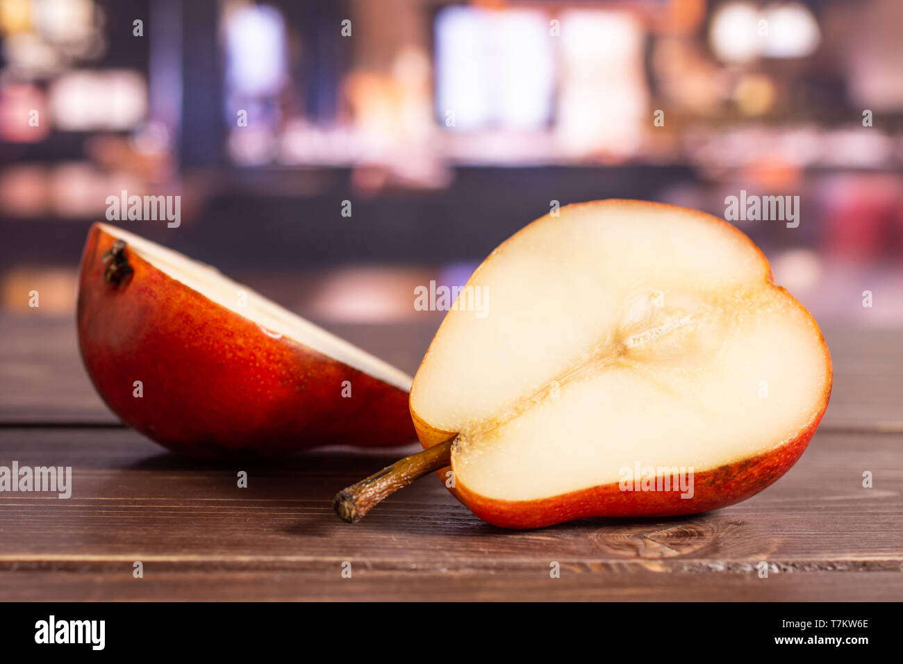 Group of two halves of fresh red pear in a restaurant Stock Photo - Alamy