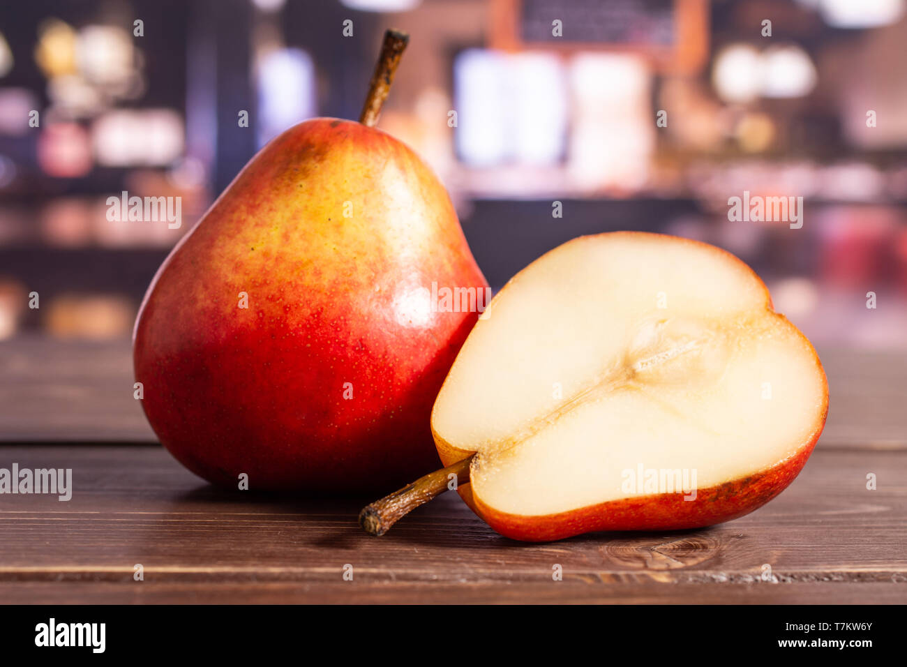 Group of one whole one half of fresh red pear in a restaurant Stock ...