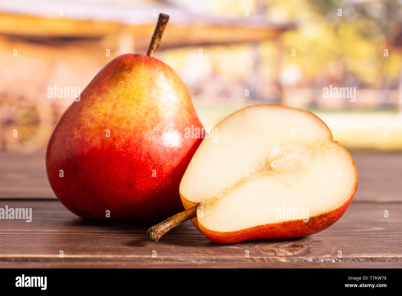Group of one whole one half of fresh red pear in a yard Stock Photo - Alamy