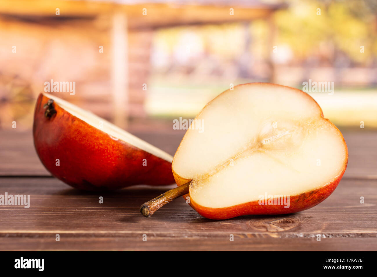 Group of two halves of fresh red pear in a yard Stock Photo - Alamy