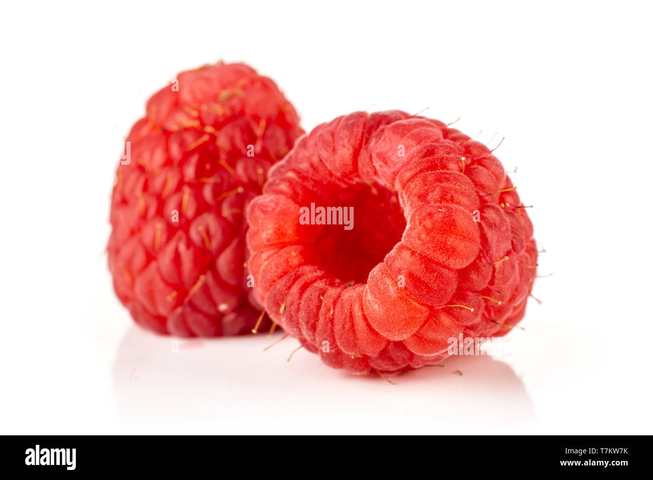 Group of two whole picked fresh red raspberry isolated on white ...