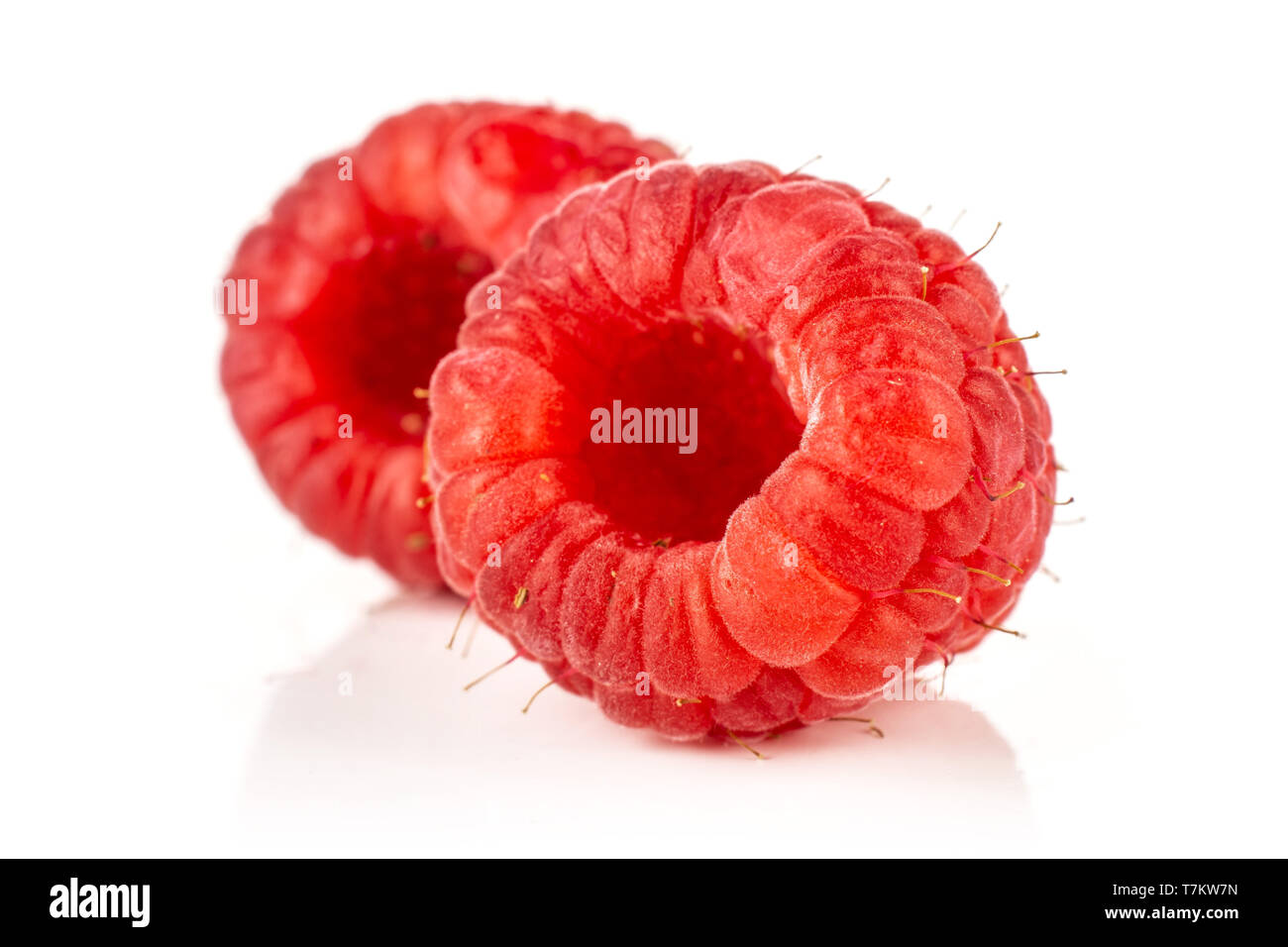 Group of two whole fresh red raspberry isolated on white background ...
