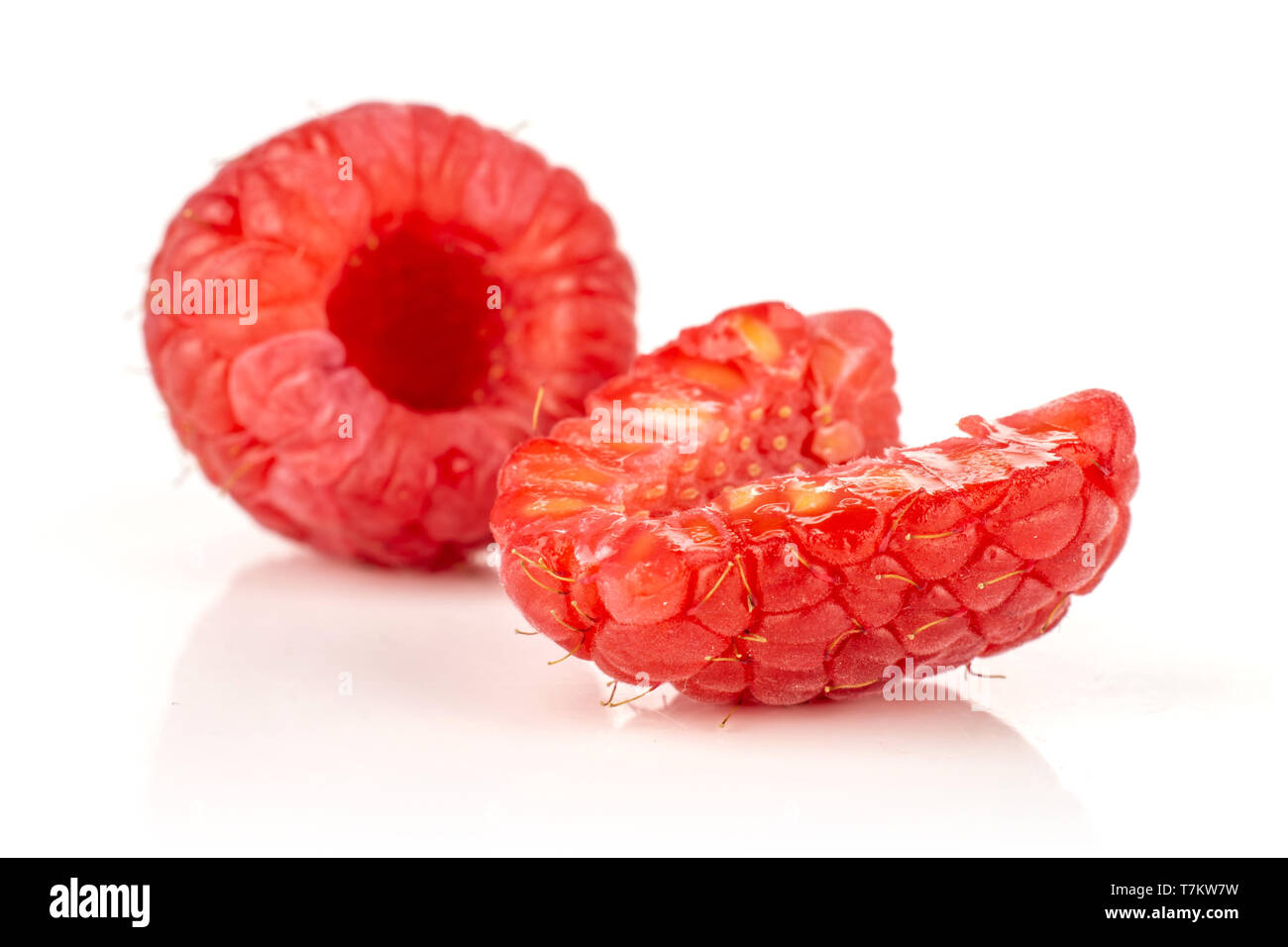 Group of one whole one half of fresh red raspberry isolated on white ...