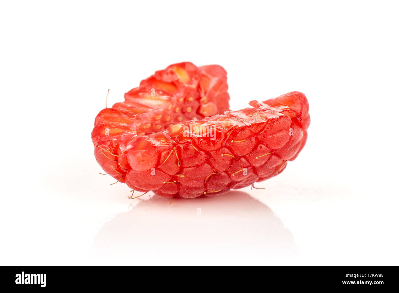 One half of fresh red raspberry isolated on white background Stock ...