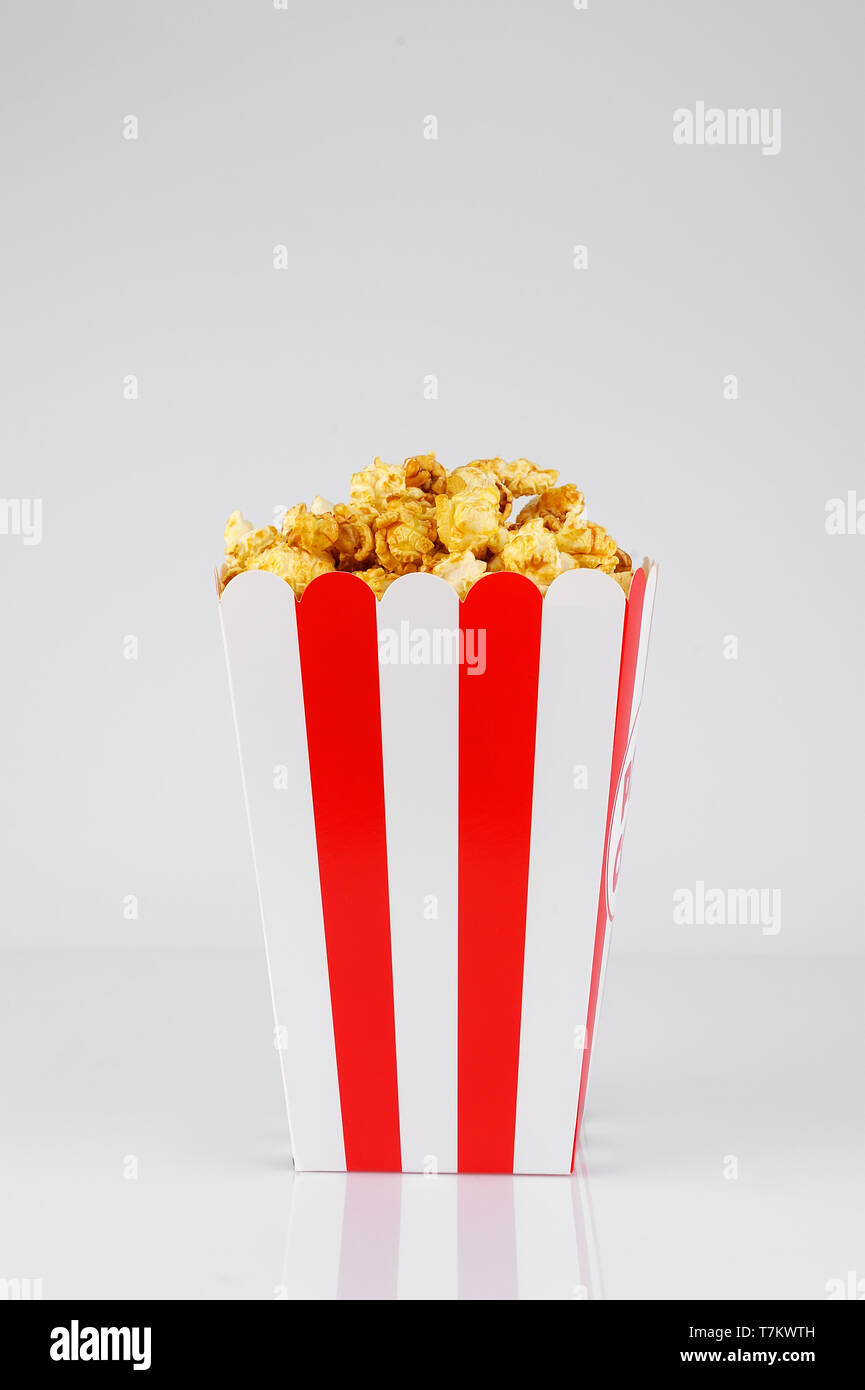 Caramel popcorn in striped paper red and white line box on white ...