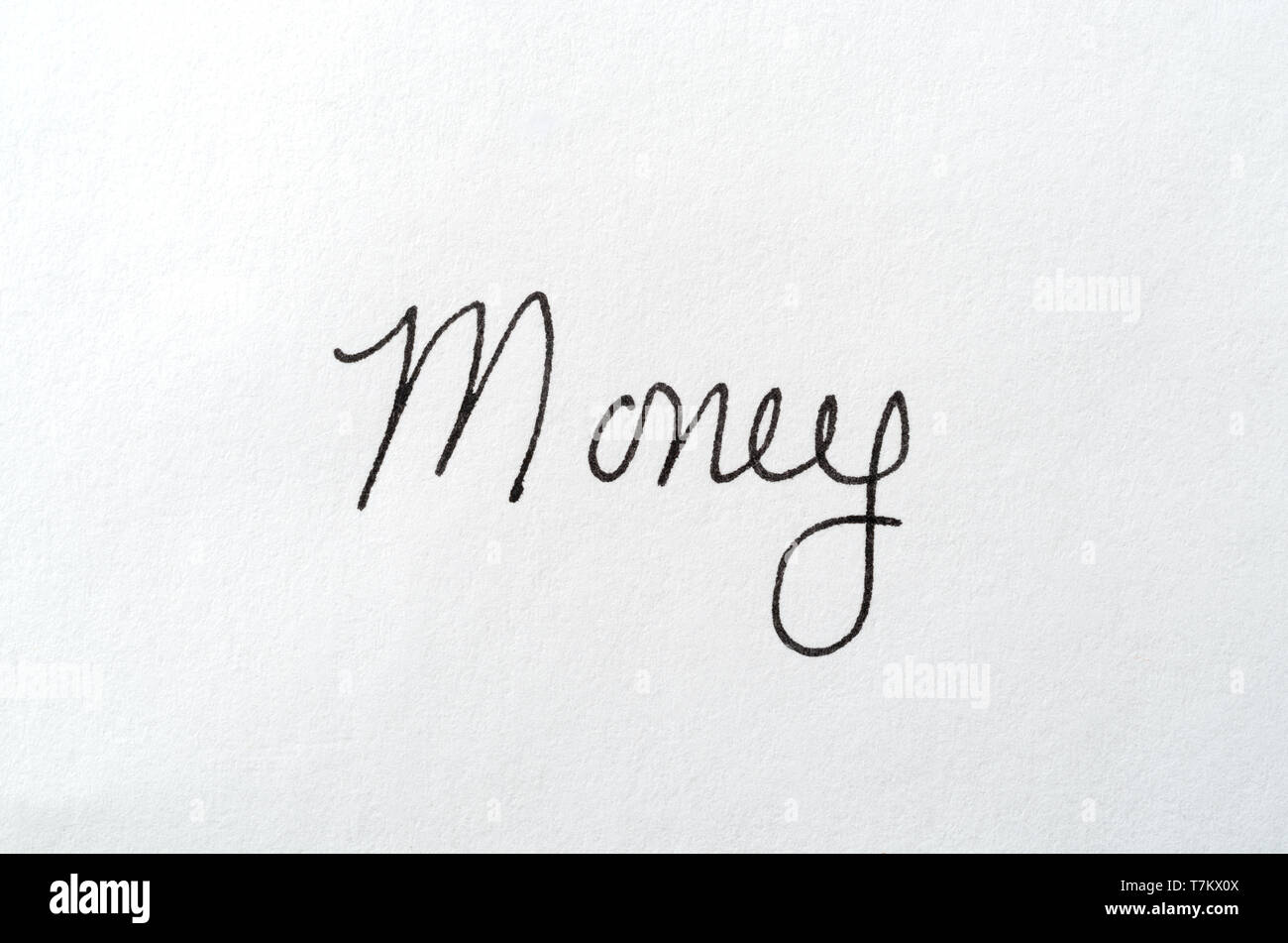 Top view of the word money written on a white piece of paper Stock ...