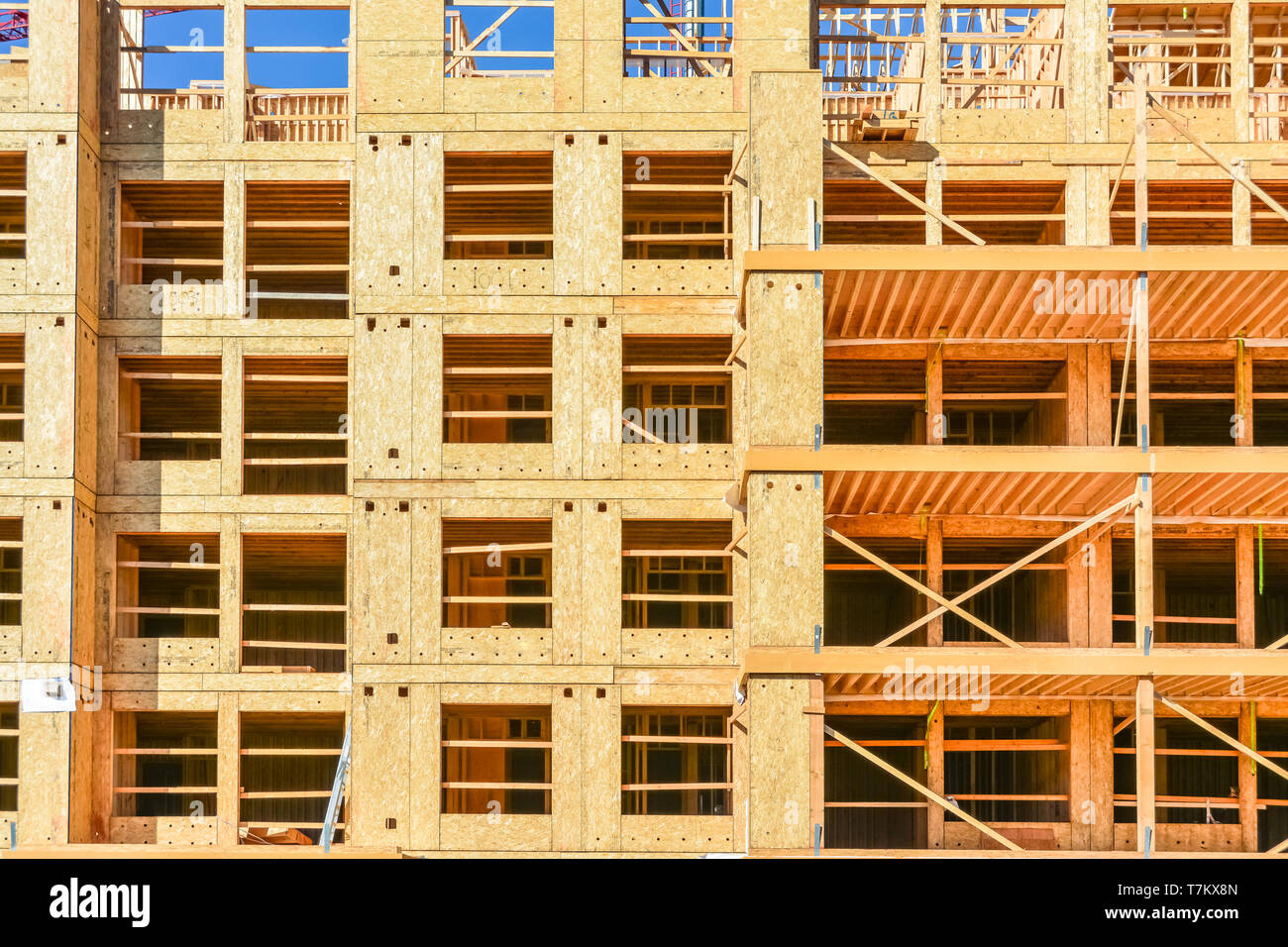 Wooden framework of brand new low-rise building on sunny day Stock ...
